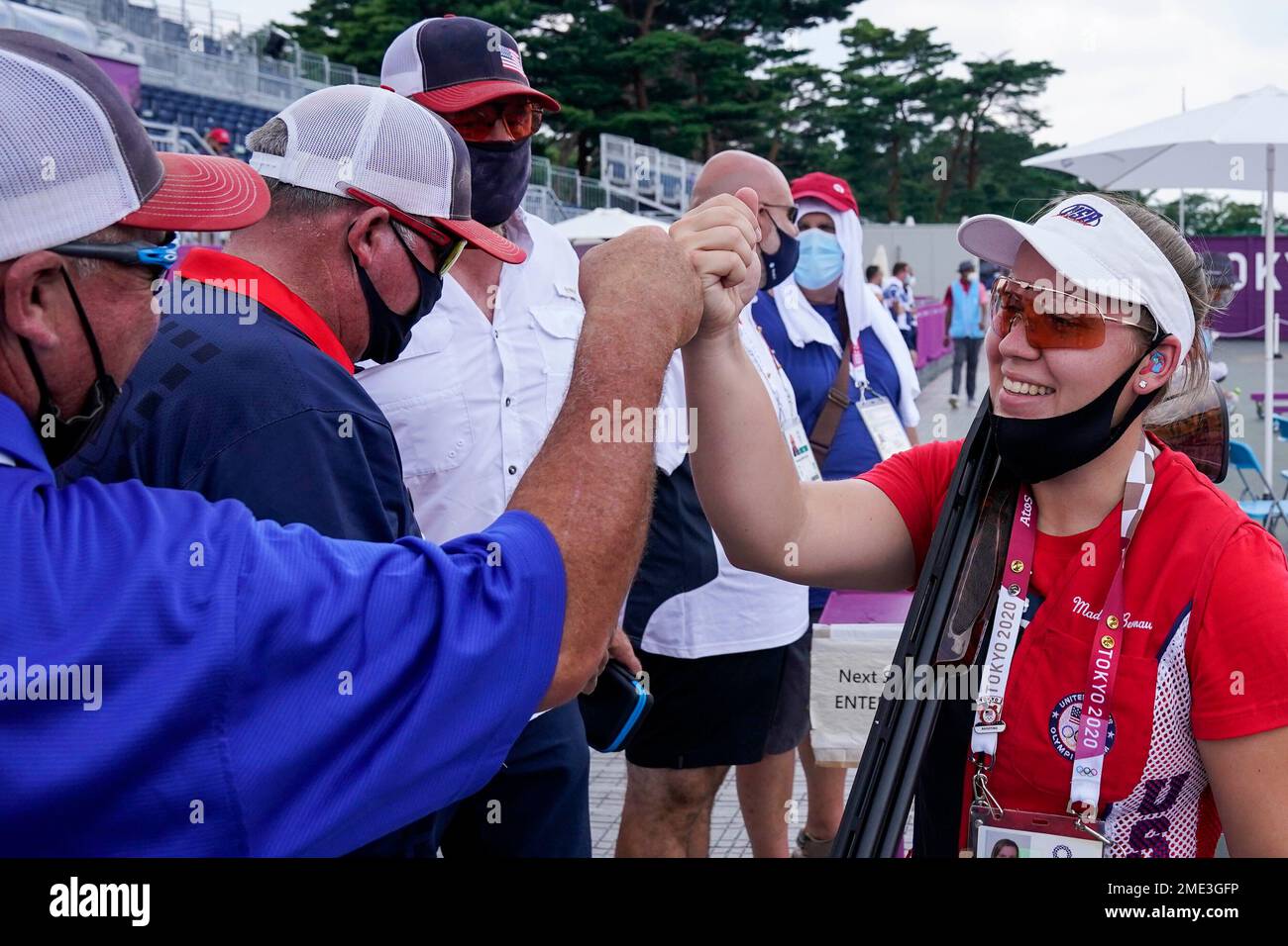 Madelynn Ann Bernau, right, of the United States, reacts with her ...