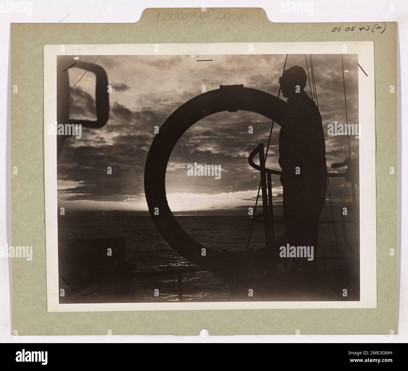 A Coast Guardsman stands vigilant on watch aboard a Coast Guard-manned ...