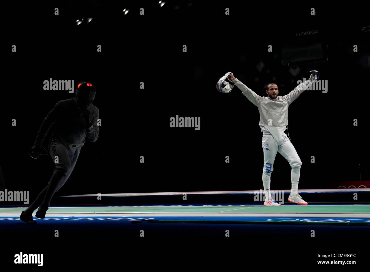 Ali Pakdaman of Iran, left, celebrates winning a point as Luca Curatoli ...