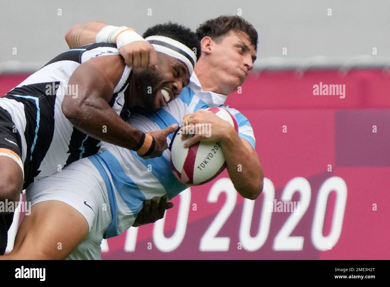 Argentina's Luciano Gonzalez, right, and Fiji's Vilimoni Botitu ...