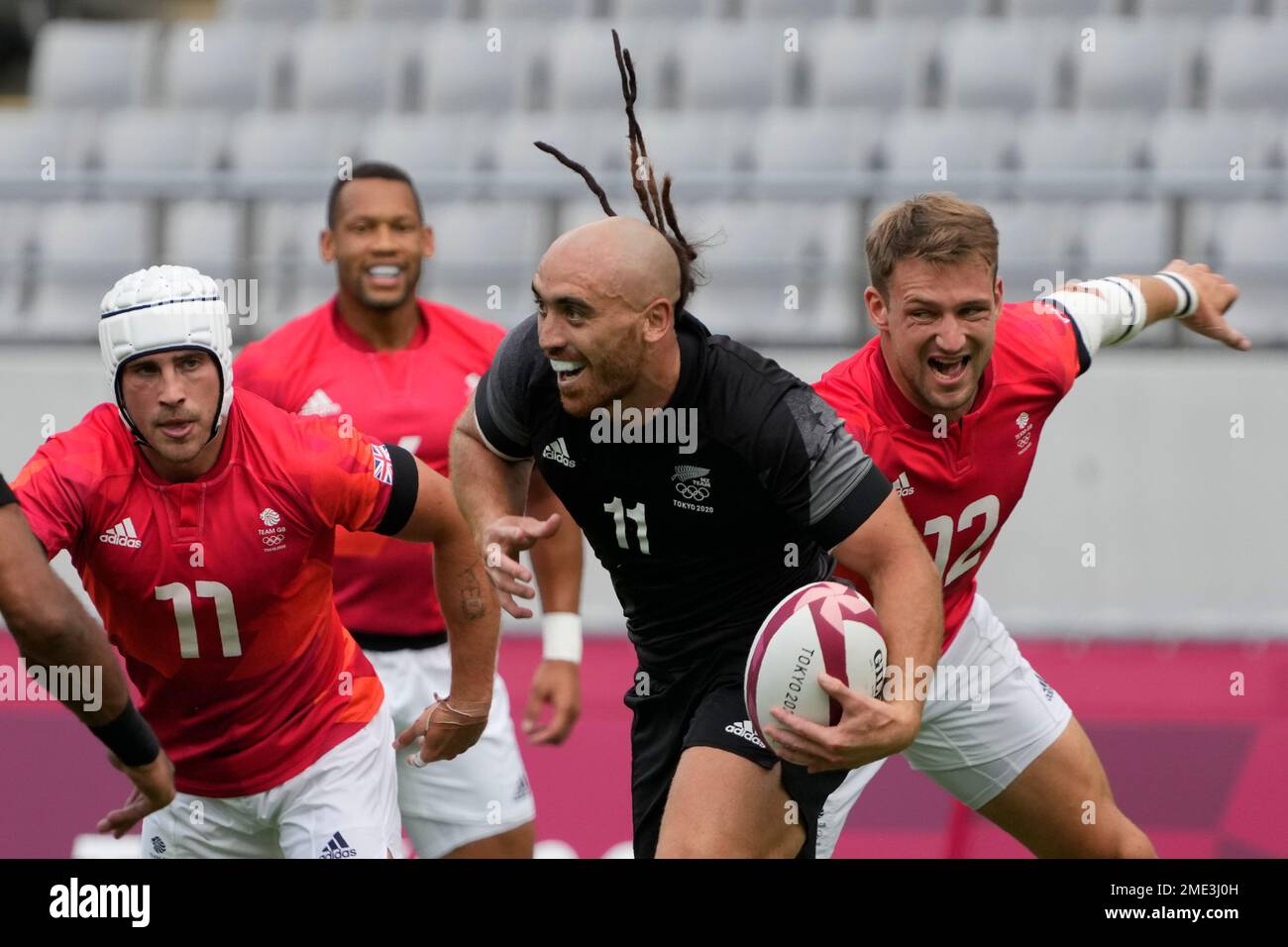 New Zealand's Joe Webber comes under pressure from Britain's Ethan ...
