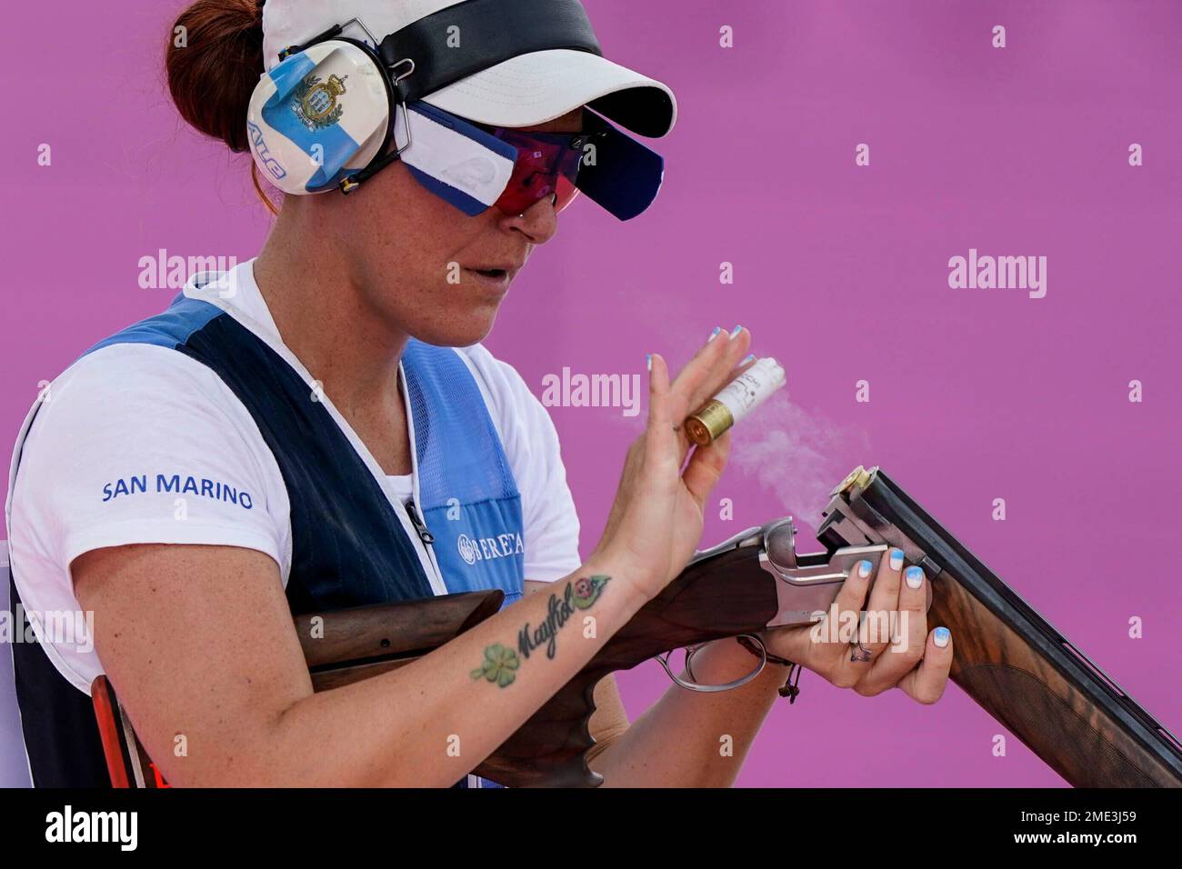 Alessandra Perilli, of San Marino, tosses her shell as she competes in ...