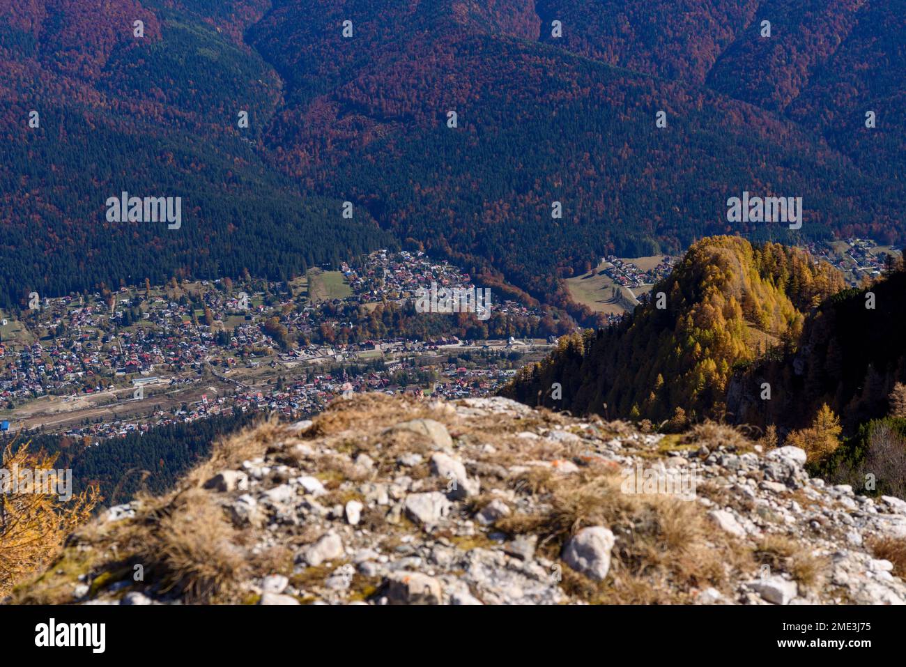A beautiful landscape with forested mountains captured from a summit ...