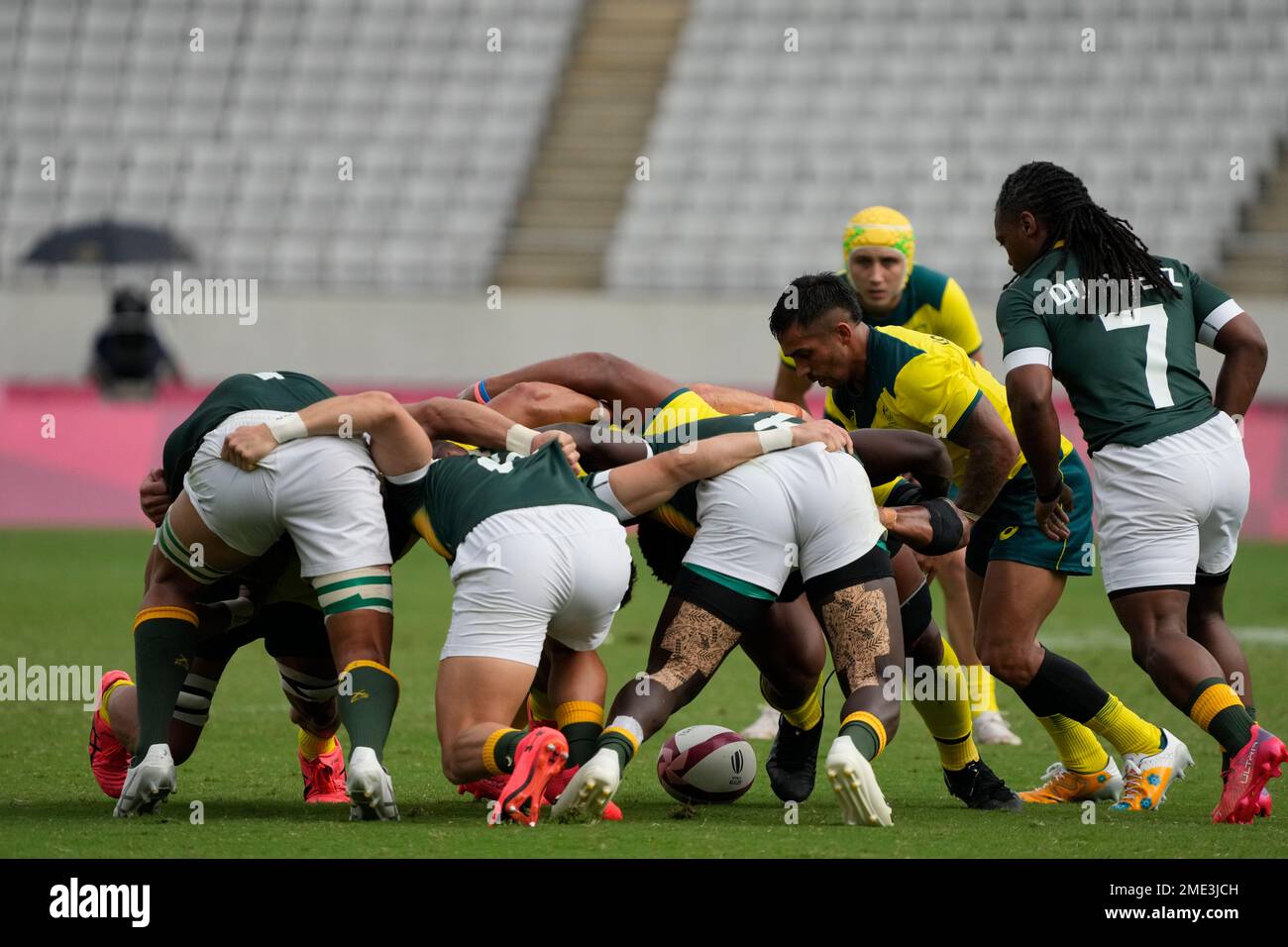 South Africa and Australia players battle for the ball in a scrum, in ...