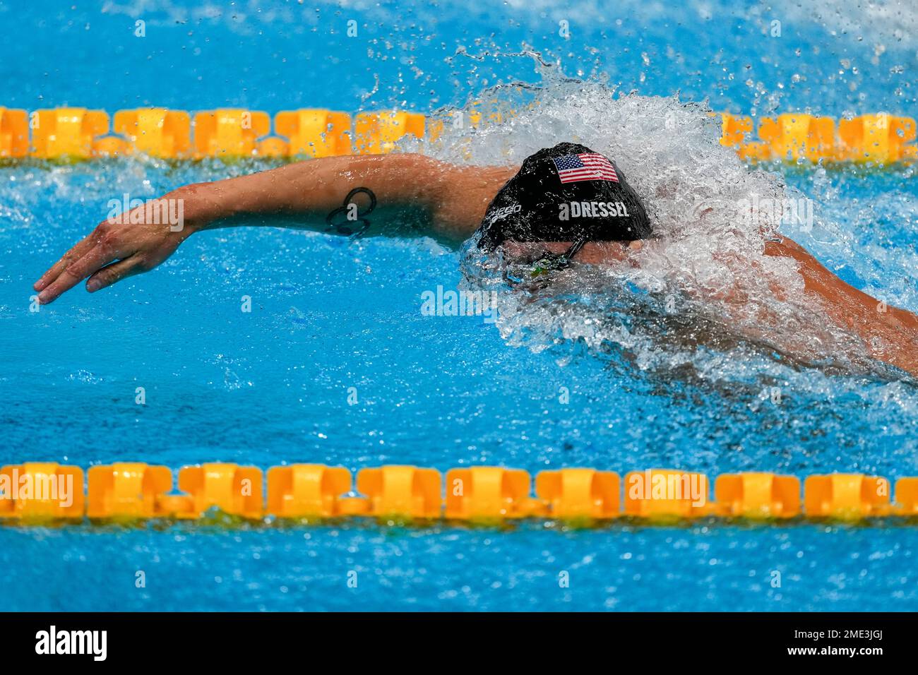 Caeleb Dressel, of the United States, swims in a men's 100-meter ...