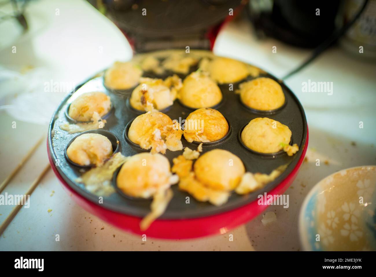 Making Takoyaki (octopus pancake) at home Stock Photo - Alamy