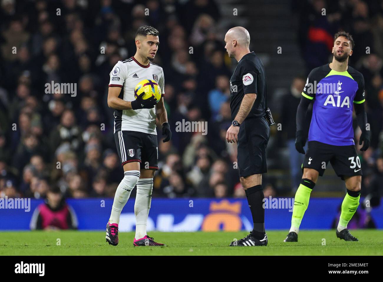 Andreas Pereira #18 of Fulham speaks to Referee Paul Tierney during the ... Andreas Pereira #18 of Fulham speaks to Referee Paul Tierney during the ...
