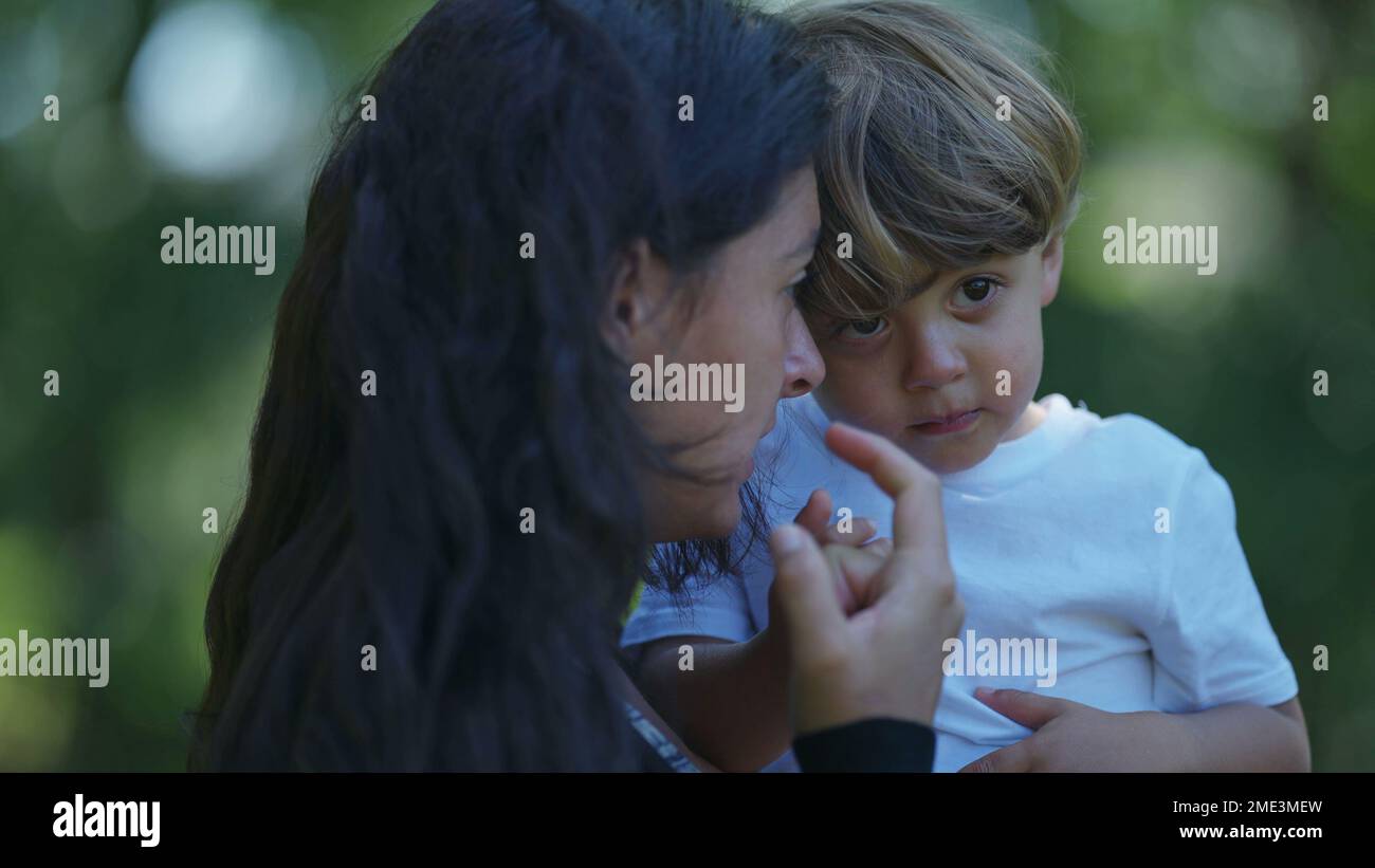Mother disciplining child parent talking to small boy who misbehaved ...