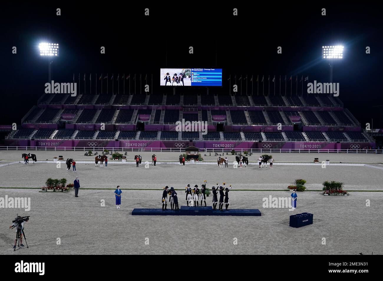 From left, silver medalist United States' Adrienne Lyle, Steffen Peters ...