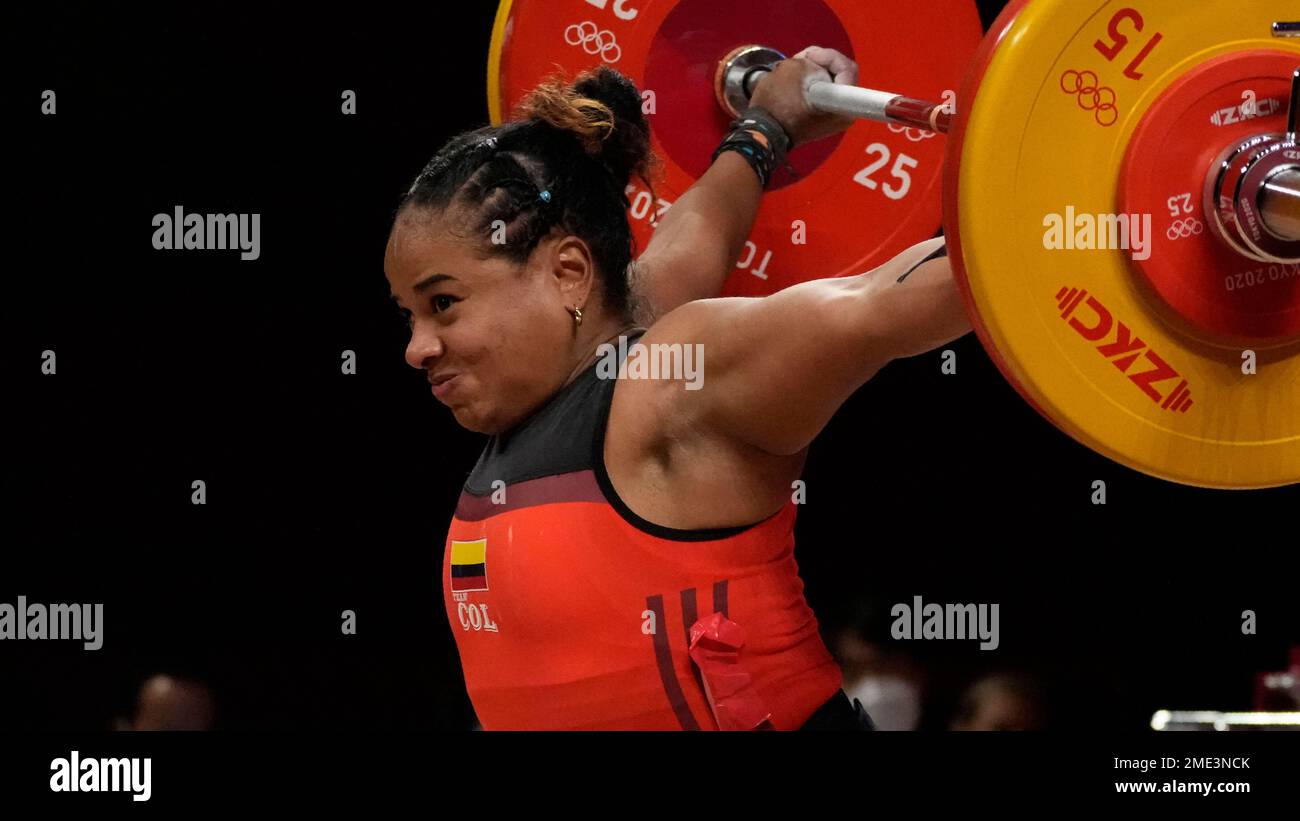 competes in the women's 64kg weightlifting event, at the 2020 Summer ...