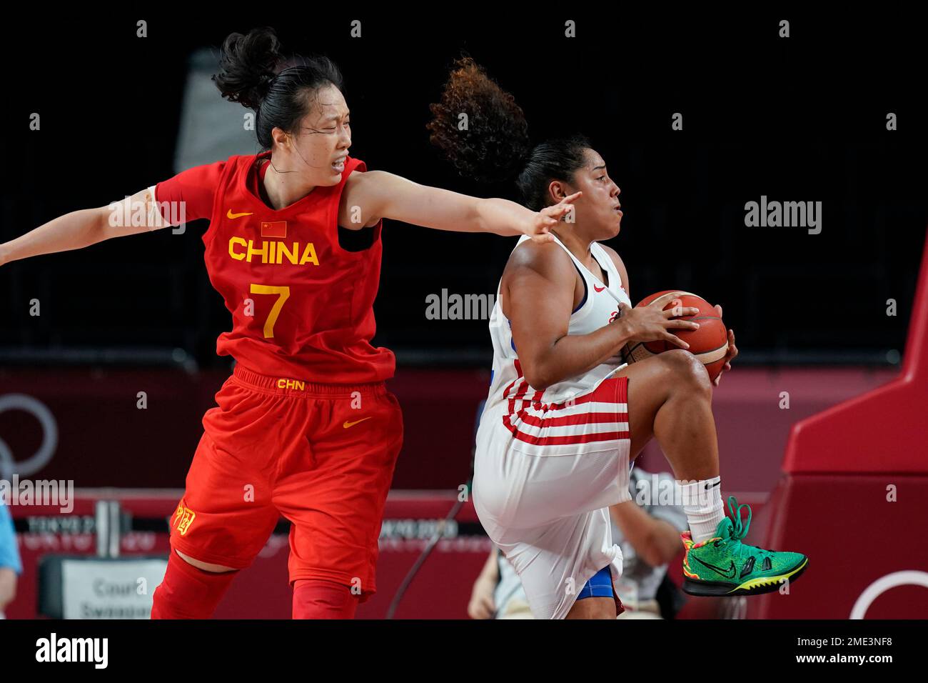 Puerto Rico's Jennifer O'Neill (0) pulls down a rebound from China's ...