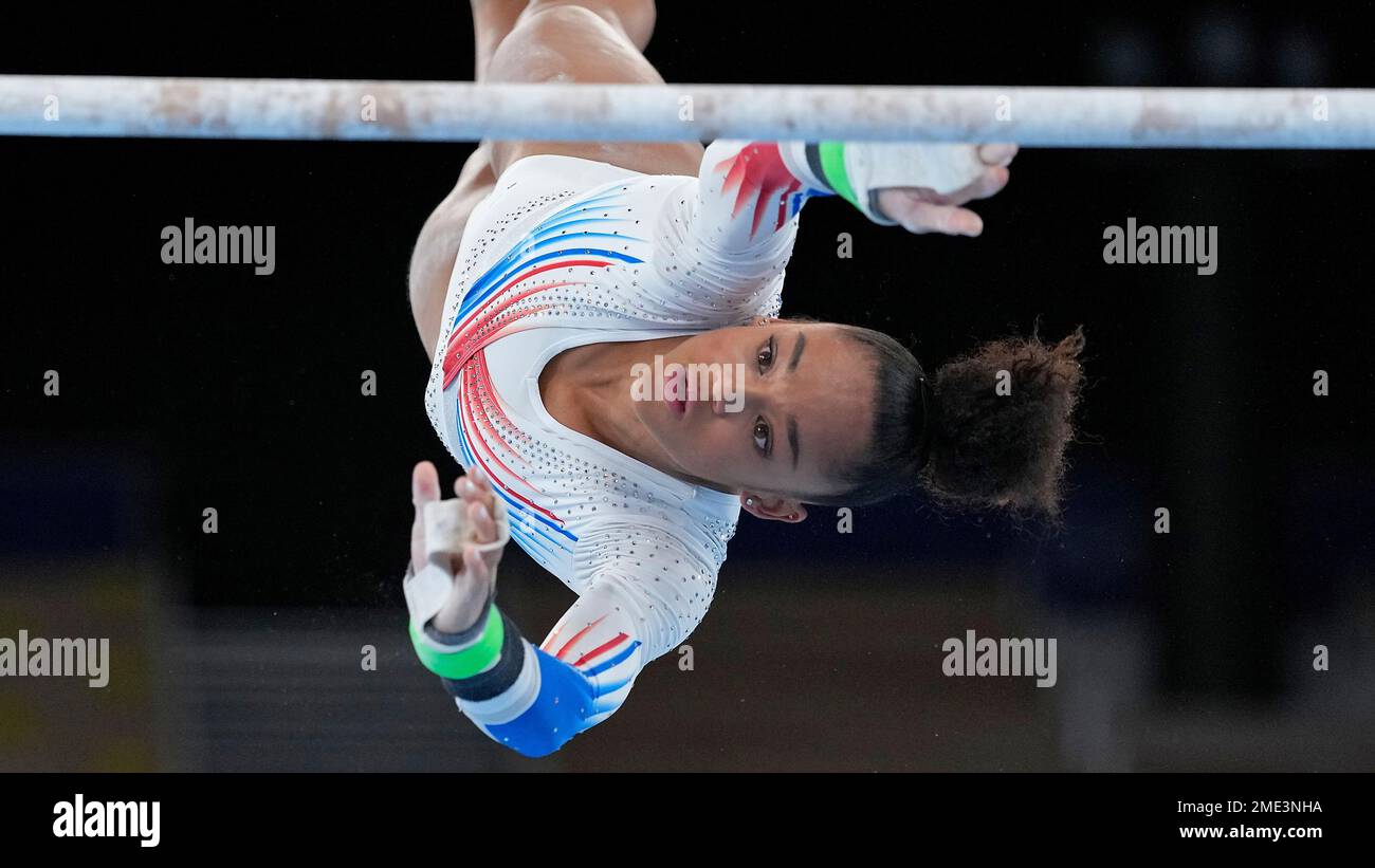 Melanie De Jesus Dos Santos, of France, performs on the uneven bars ...
