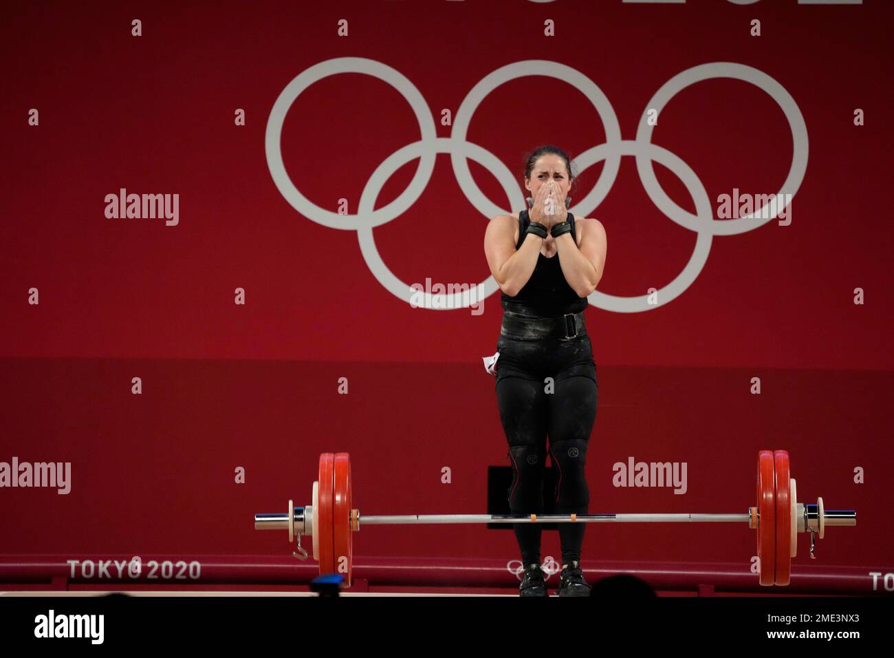 Maude G. Charron of Canada celebrates after a lift in the women's 64kg ...