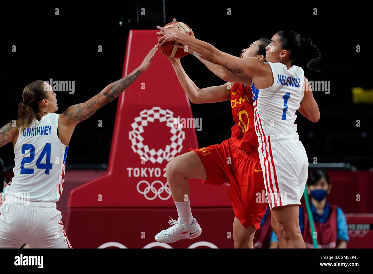 China's Zhenqi Pan (10) is fouled by Puerto Rico's Tayra Melendez (1 ...
