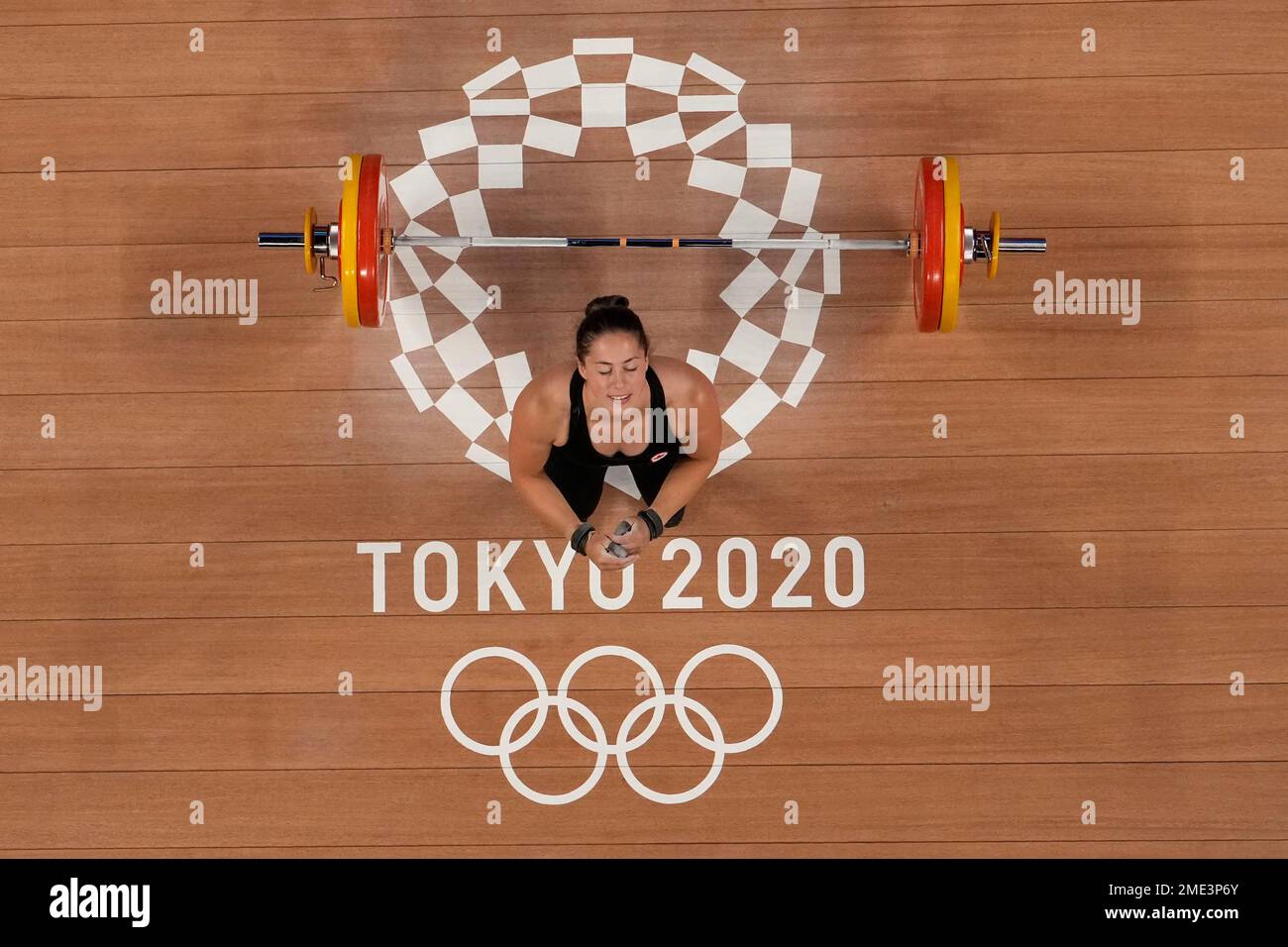 Maude G. Charron of Canada drops the barrel during a lift in the women ...