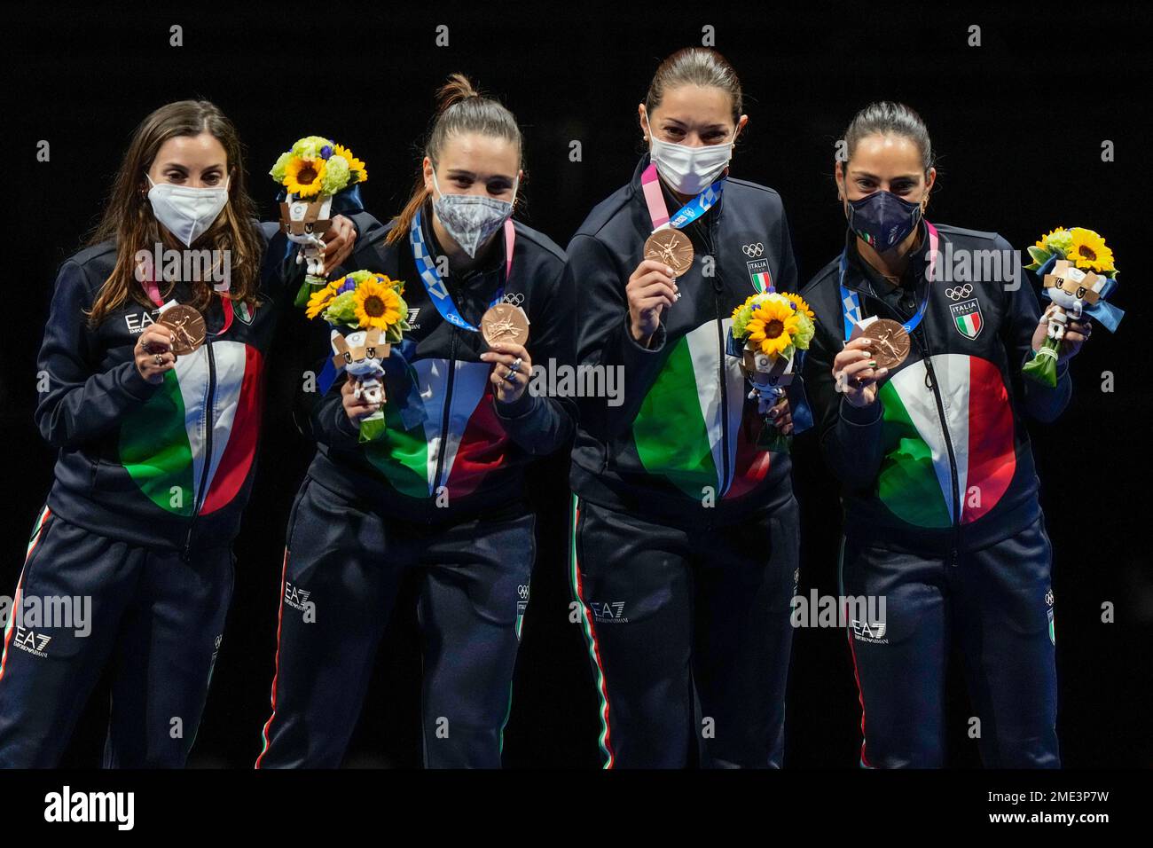 Italy fencing team celebrate with the bronze medals on the podium of ...