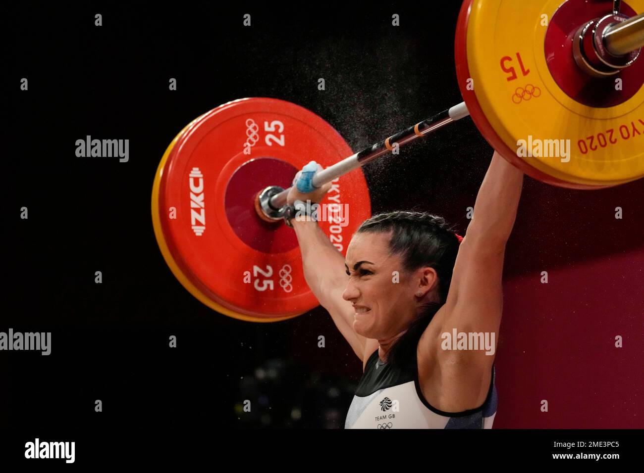 Sarah Davies of Britain competes in the women's 64kg weightlifting ...