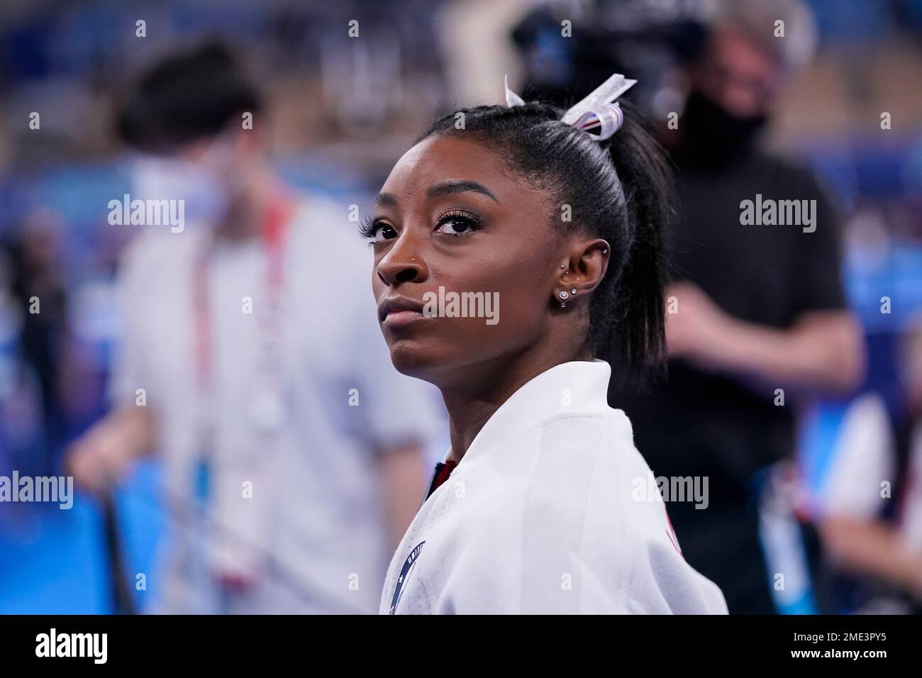 Simone Biles, of the United States, waits for her turn to perform ...