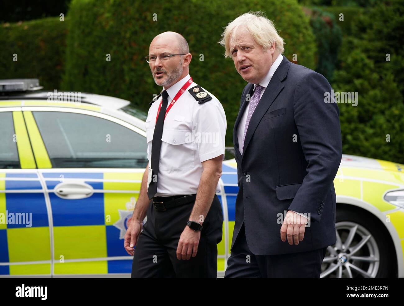 Britain's Prime Minister Boris Johnson, walks with Chief Constable ...