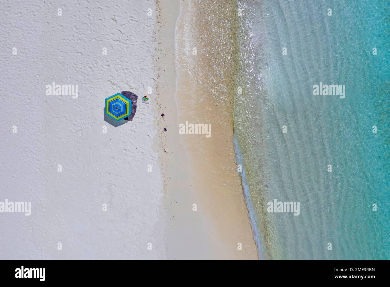 Aerial view of umbrella on shore at beach Stock Photo - Alamy