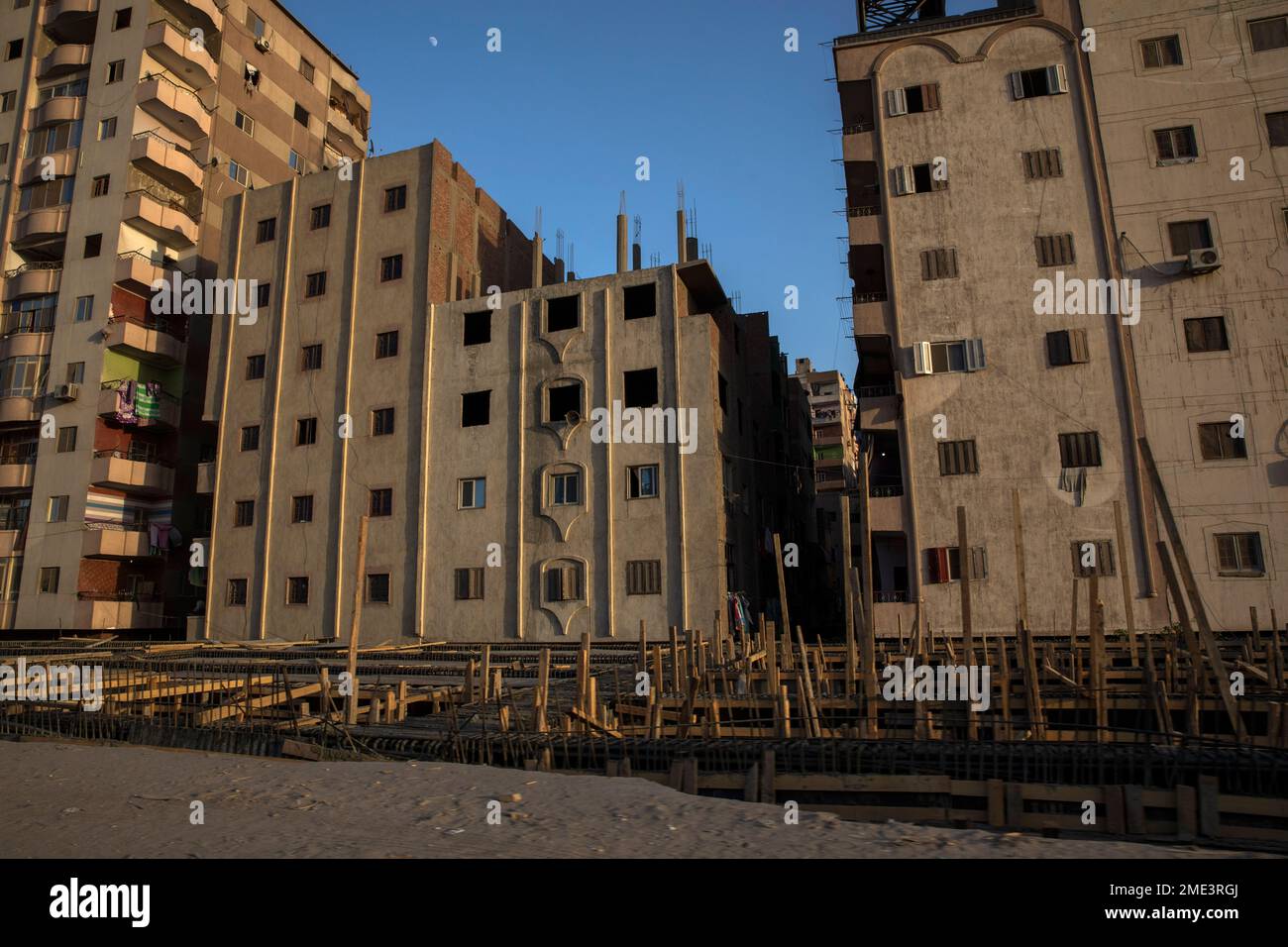 A bridge is under construction close to residential buildings, part of ...