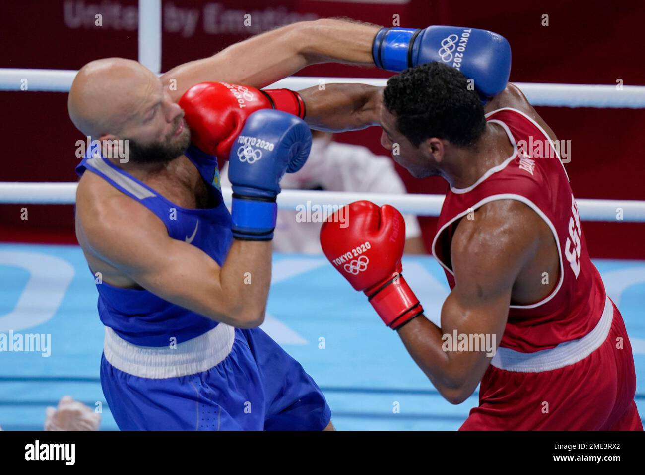 Spain's Enmanuel Reyes Pla, right, punches Kazakhstan's Vassiliy Levit ...