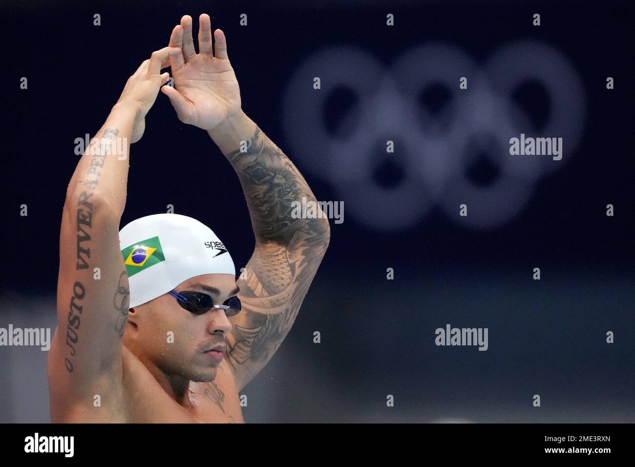 Gabriel Santos of Brazil stretches ahead of his heat of the men's 100 ...