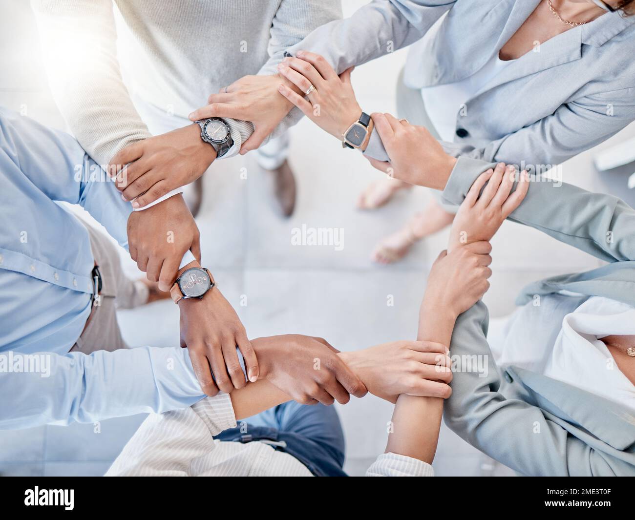 Above business people, trust circle and holding hands for motivation ...