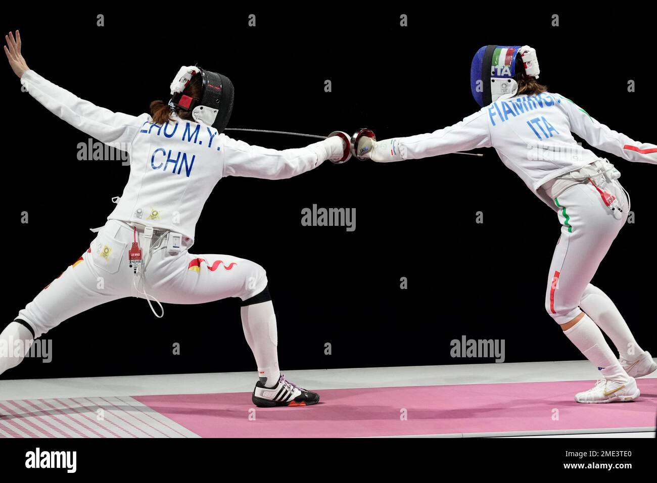 Chu Mingye of China, left, and Rossella Fiamingo of Italy compete in ...