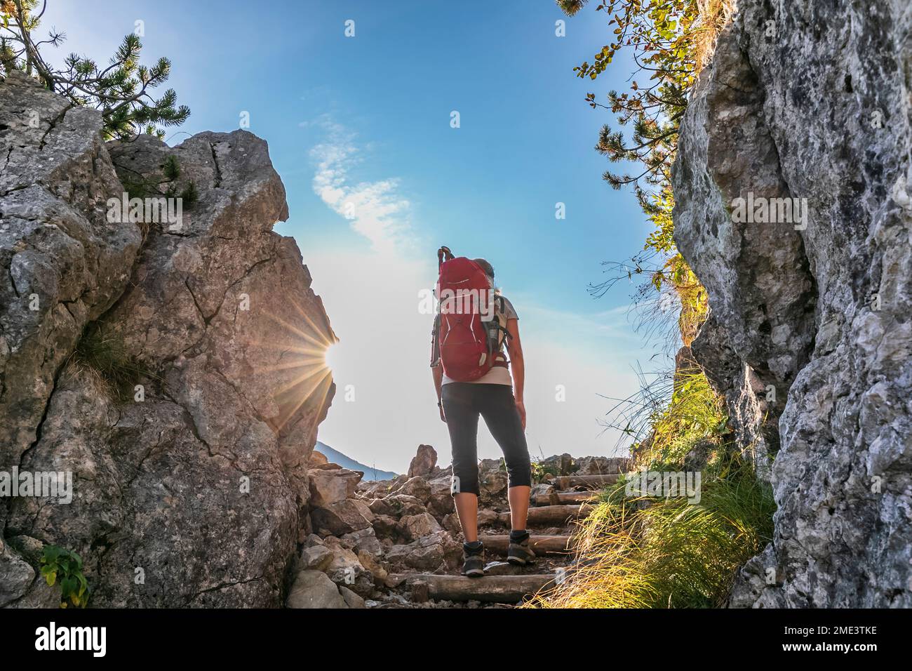 Germany, Bavaria, Female hiker standing on stone steps leading to ...