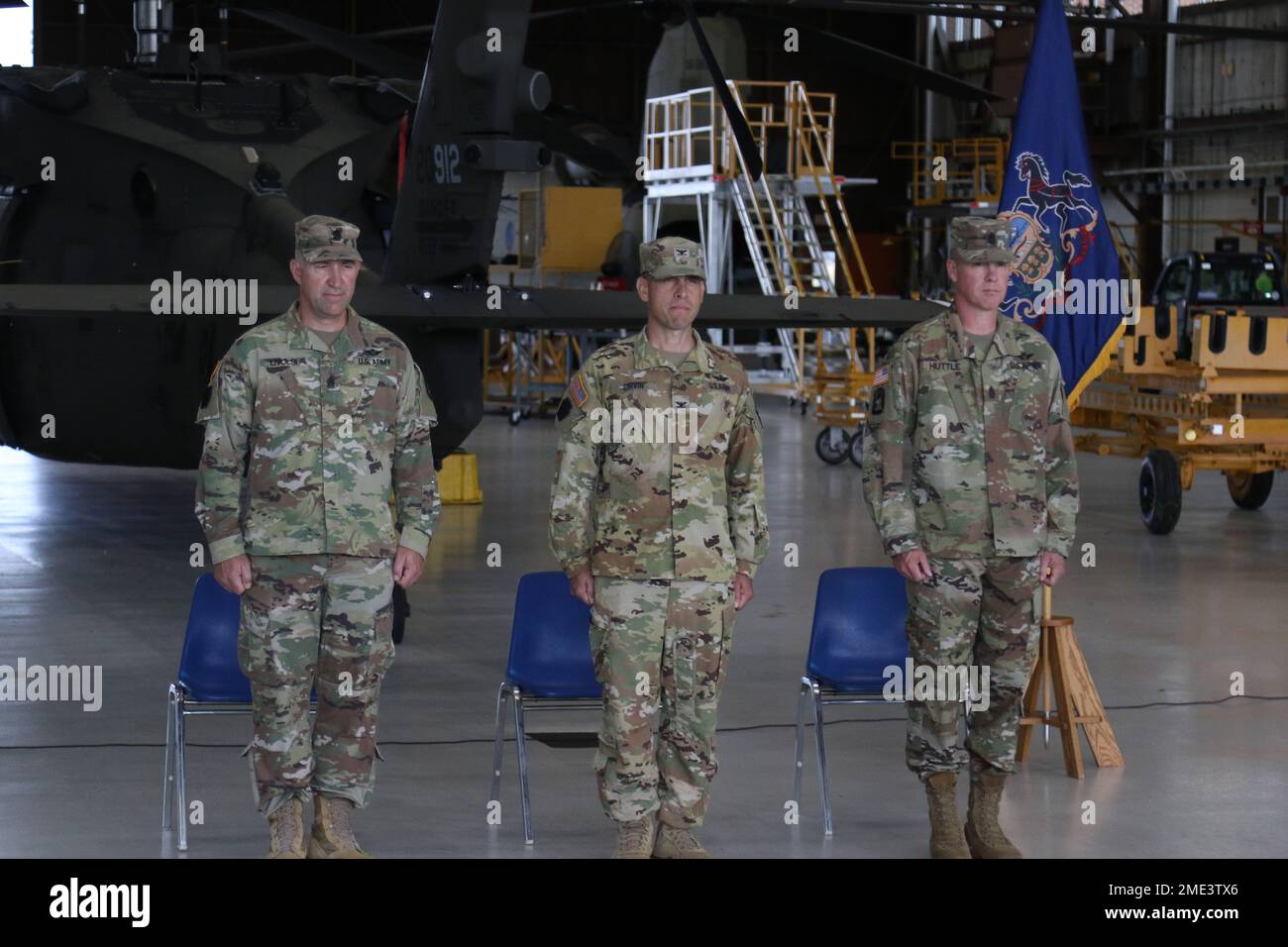 From left, Command Sgt. Maj. Sean Livolsi, Col. Michael Girvin and ...