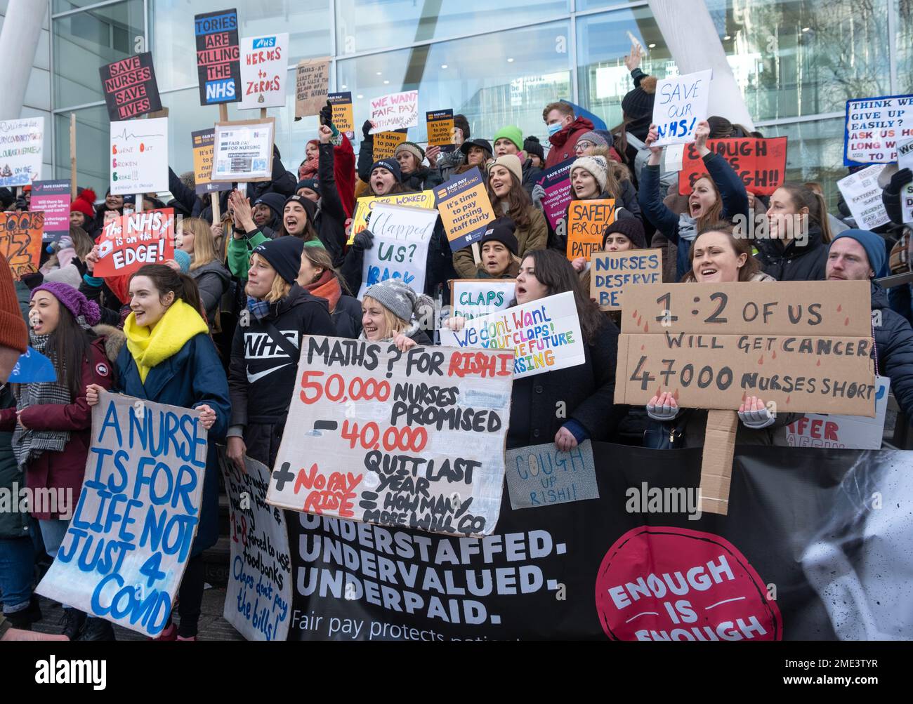 Striking nurses with placards, demonstrating outside University College ...