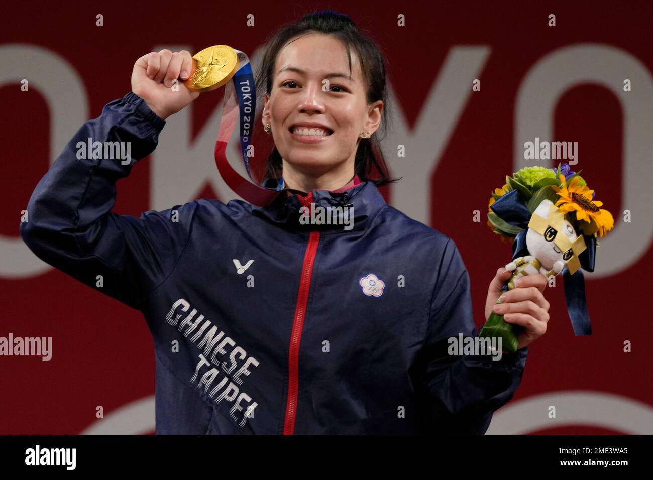 Kuo Hsing-Chun of Taiwan celebrates on the podium after winning the ...