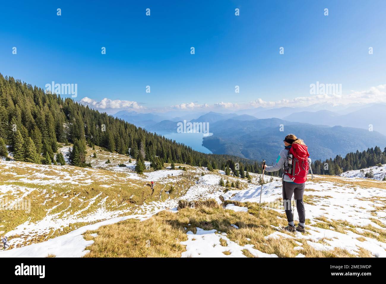 Female hiker looking walchensee lake seen from summit ester mountains ...