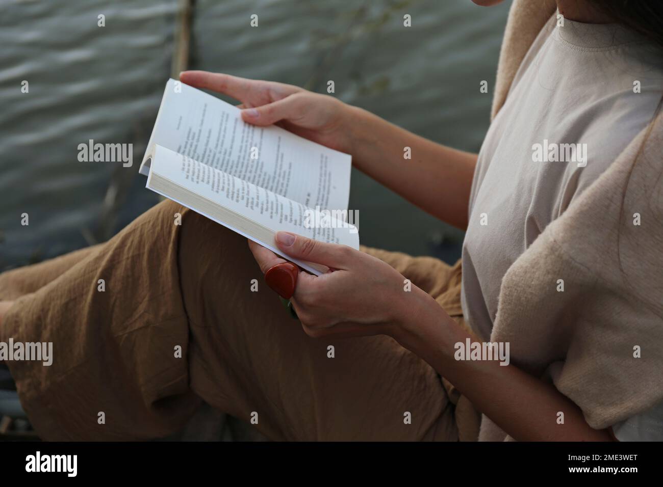 Woman reading book river hi-res stock photography and images - Alamy