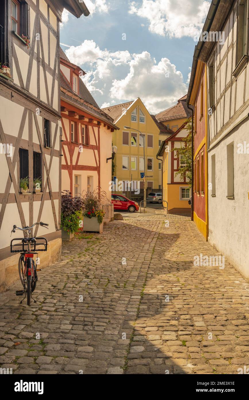 Germany, Bavaria, Forchheim, Half-timbered houses along cobblestone ...