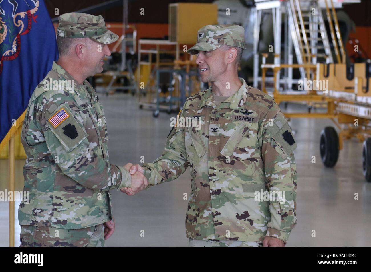 U.S. Army Command Sgt. Maj. Sean Livolsi, left, outgoing senior ...