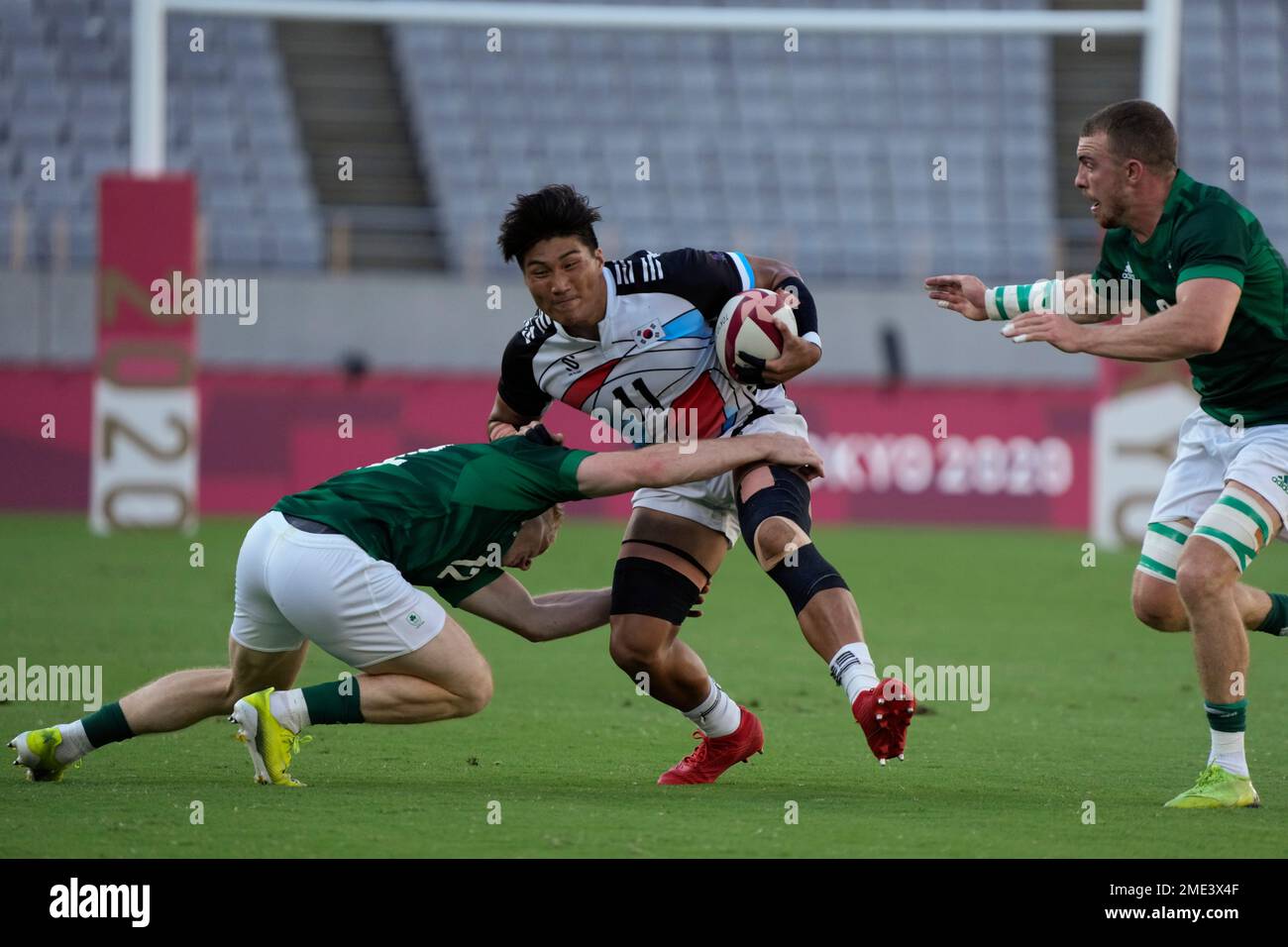 South Korea's Choi Seong-deok is tackled by Ireland's Gavin Mullin as ...