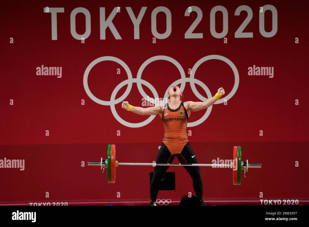 Sabine Beate Kusterer of Germany celebrates after a lift as she ...