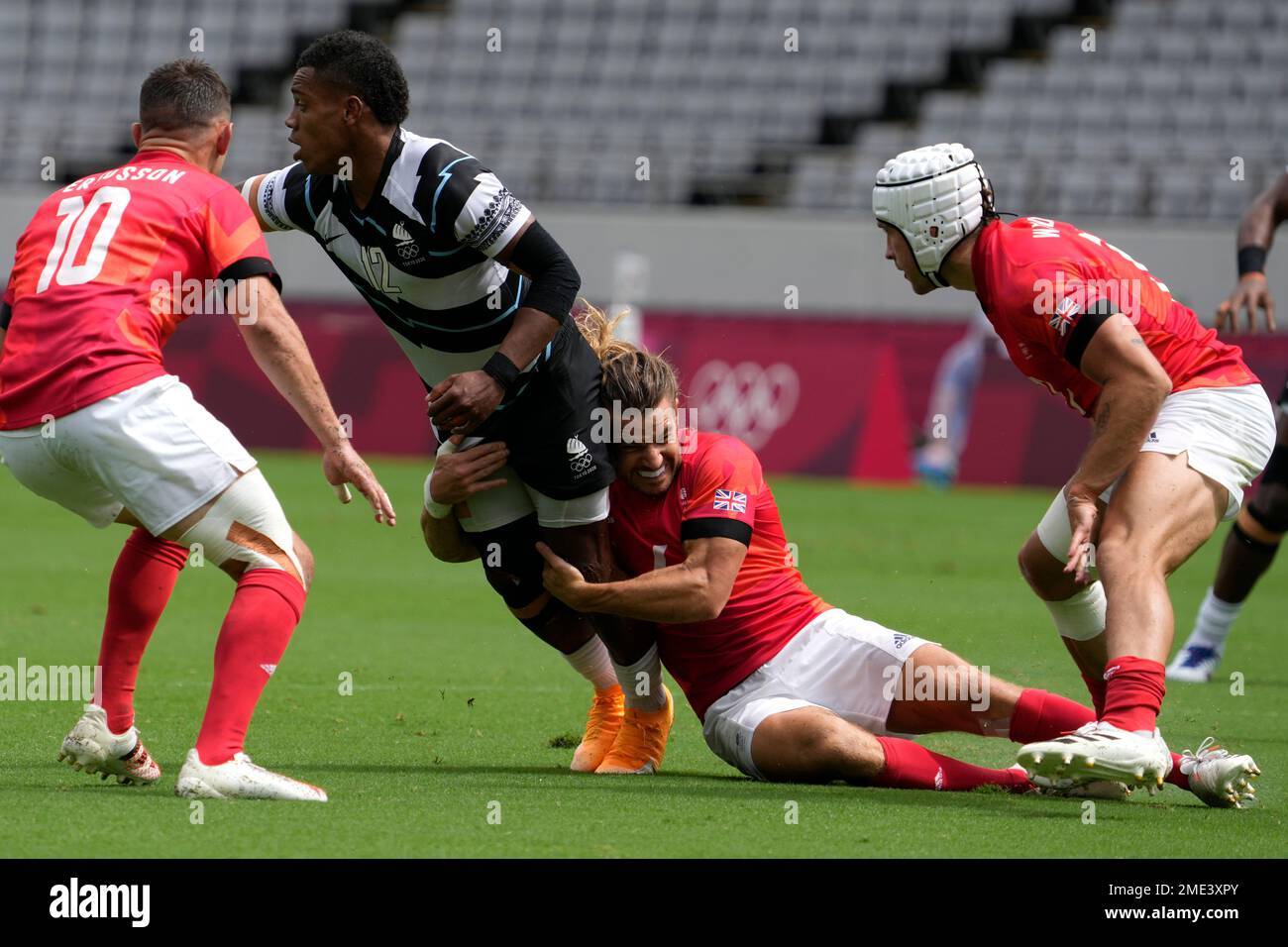 Fiji's Napolioni Bolaca is tackled by Great Britain's Tom Mitchell ...