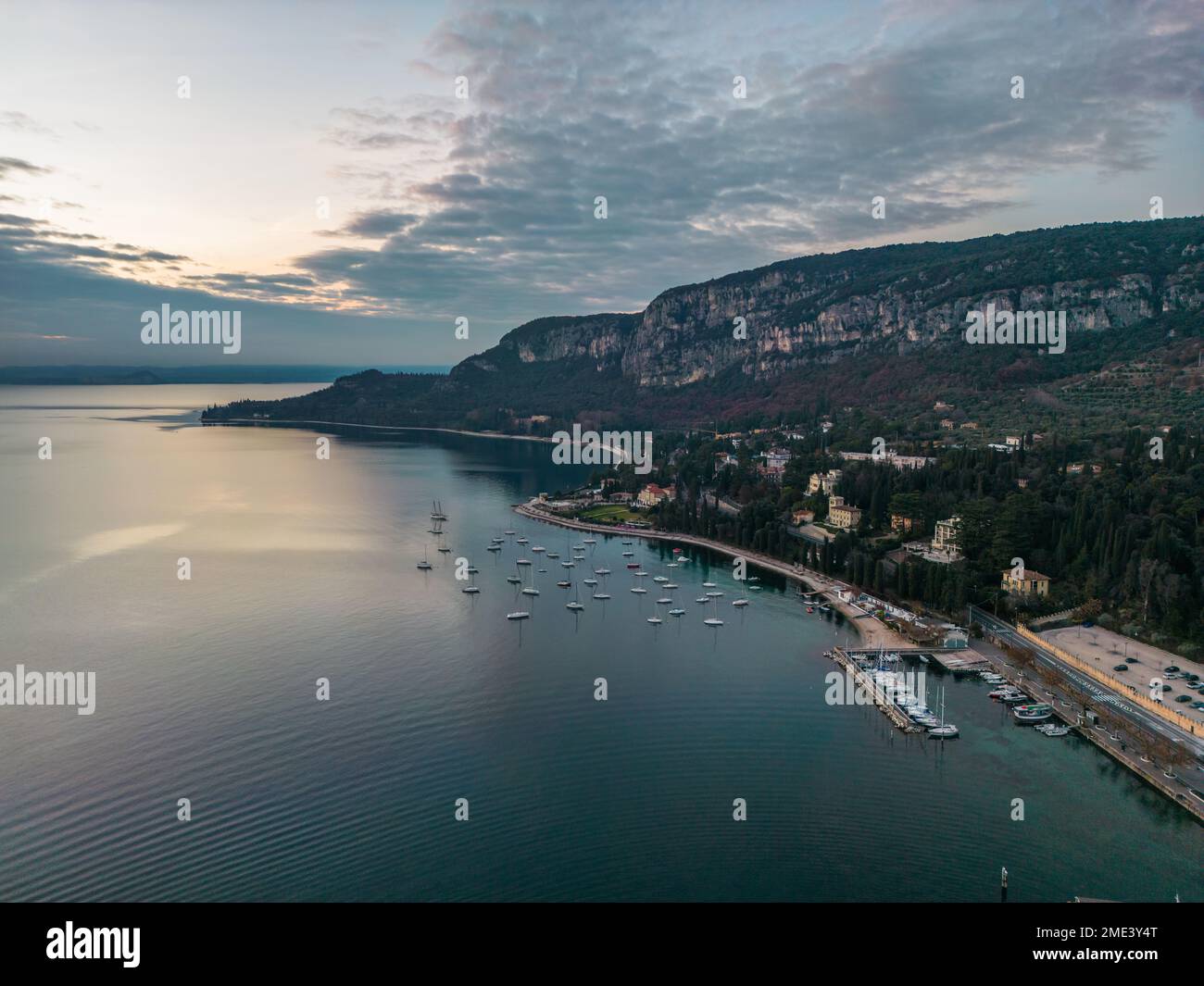 An aerial view of an ocean coast with houses on it, surrounded by a ...