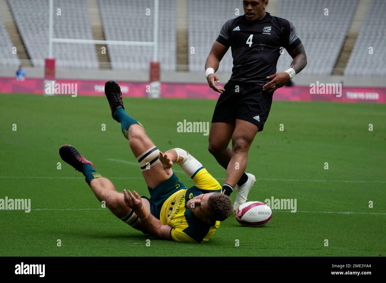 Australia's Nick Malouf takes a tumble after scoring a try, as New ...