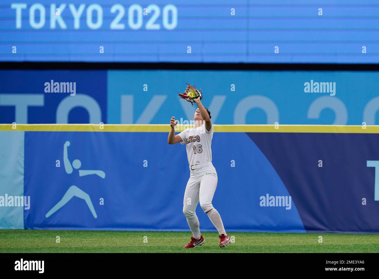 Mexico's Tatyana Forbes catches a fly out by Canada's Emma Entzminger ...