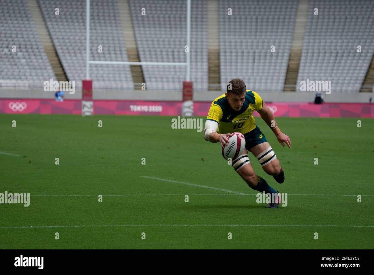 Australia's Nick Malouf runs to score a try in Australia's men's rugby ...