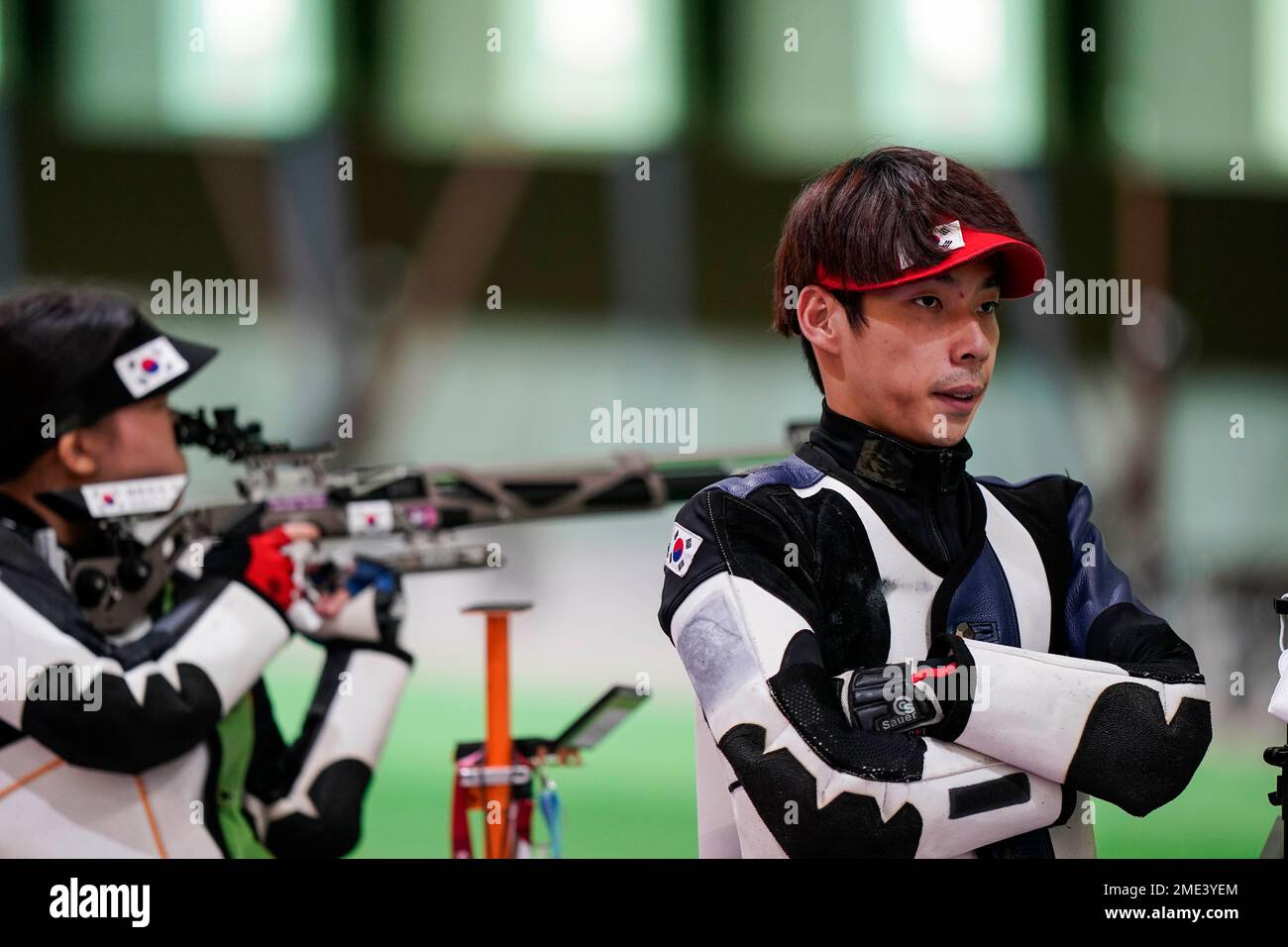Eunji Kwon, left, and Taeyun Nam, of South Korea, compete in the mixed team 10-meter air rifle ...