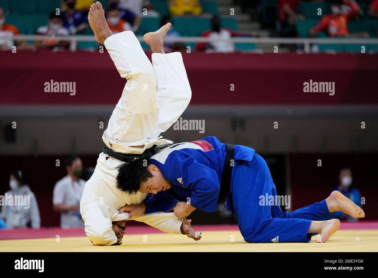 Lee Sung-ho of South Korea throws Nacif Elias of Lebanon, left, during ...