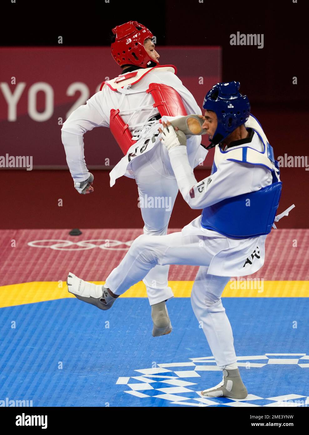 Afghanistan's Farzad Mansouri, right, is attacked by South Korea's Kyo ...