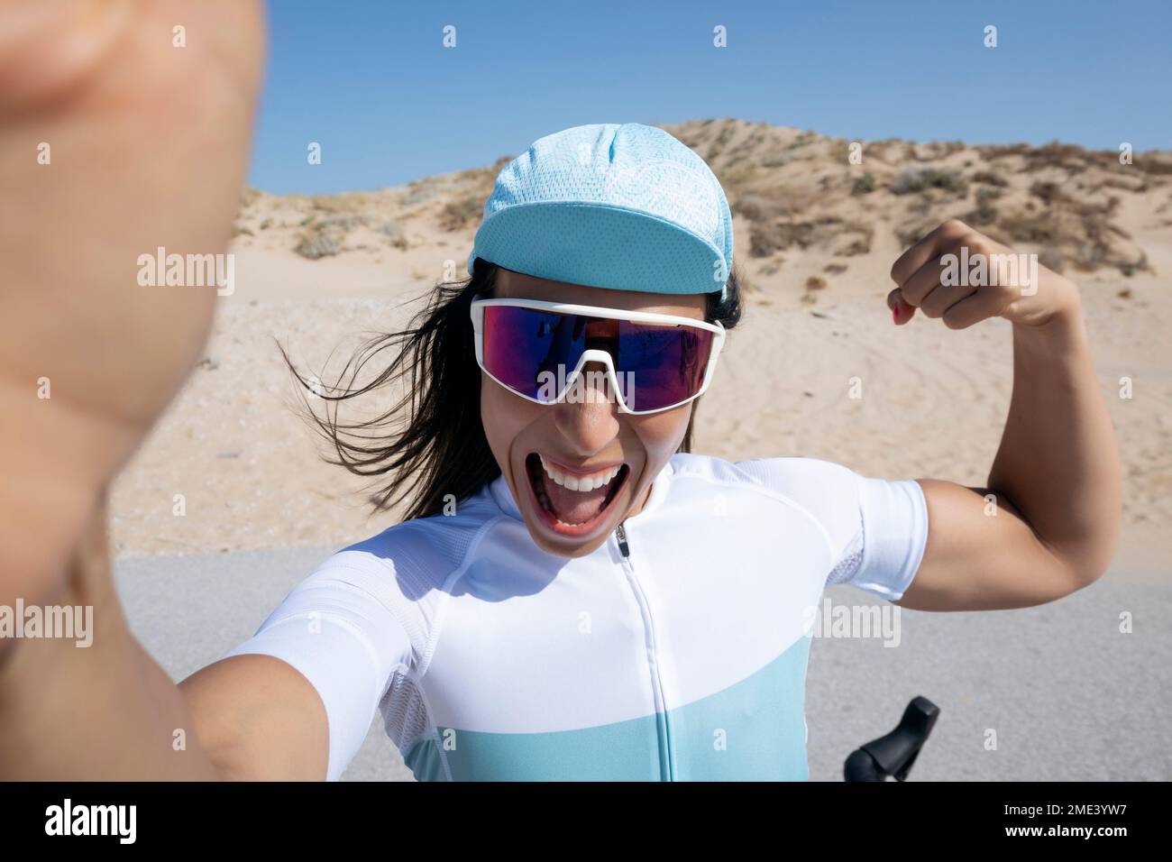 Mature woman flexing muscles outdoors hi-res stock photography and ...