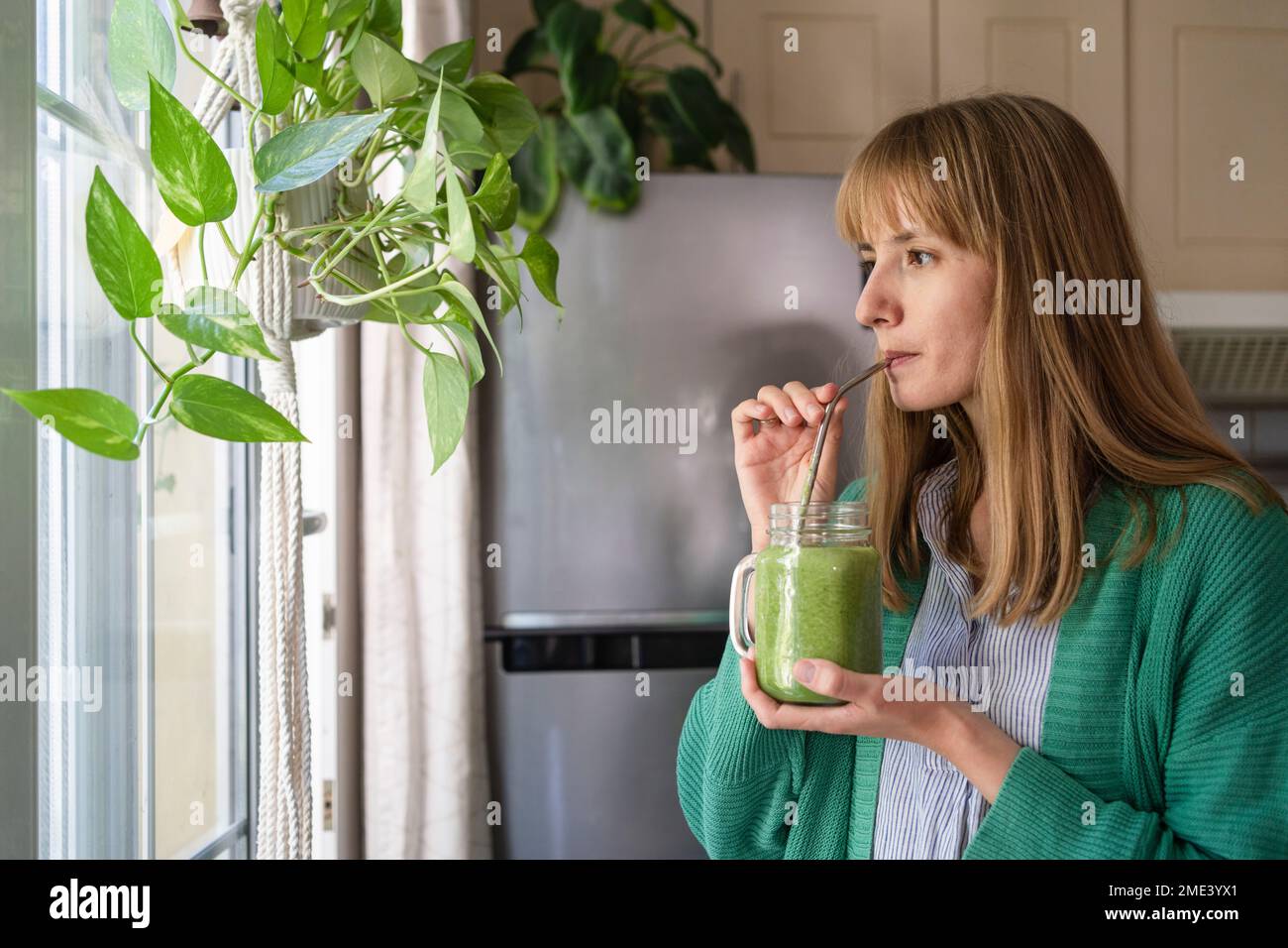 Woman drinking smoothie standing hi-res stock photography and images ...