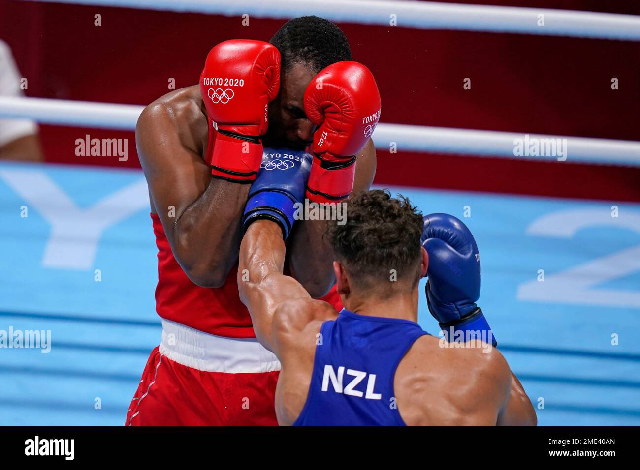 New Zealand's David Nyika, lands a punch to Youness Baalla , of Morocco ...